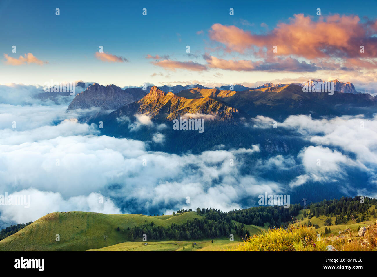 Great view of the foggy Val di Fassa valley with passo Sella. National ...
