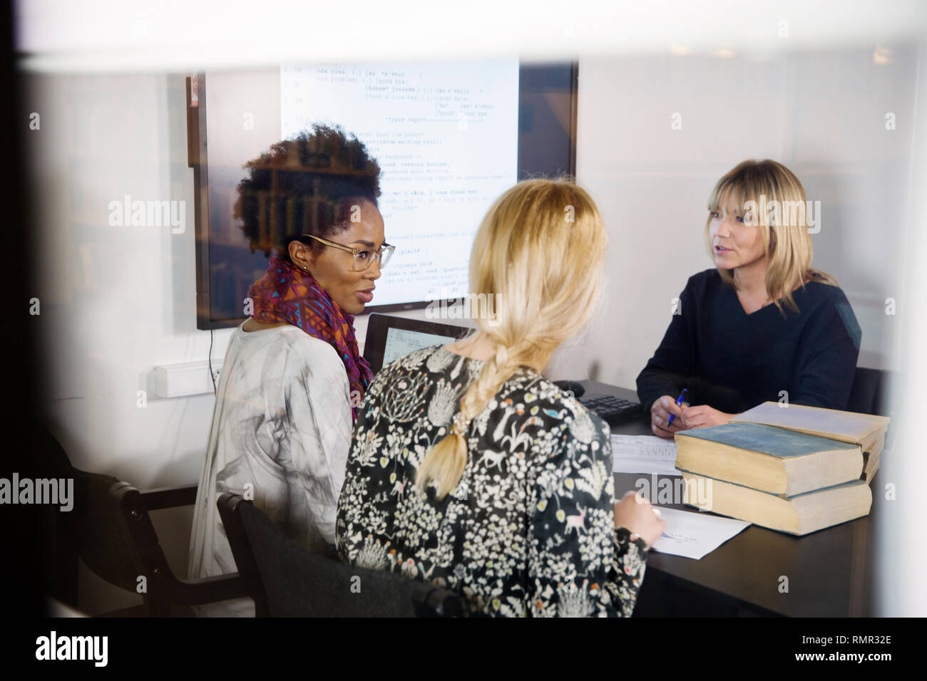 Three colleagues sitting business meeting hi-res stock photography and ...