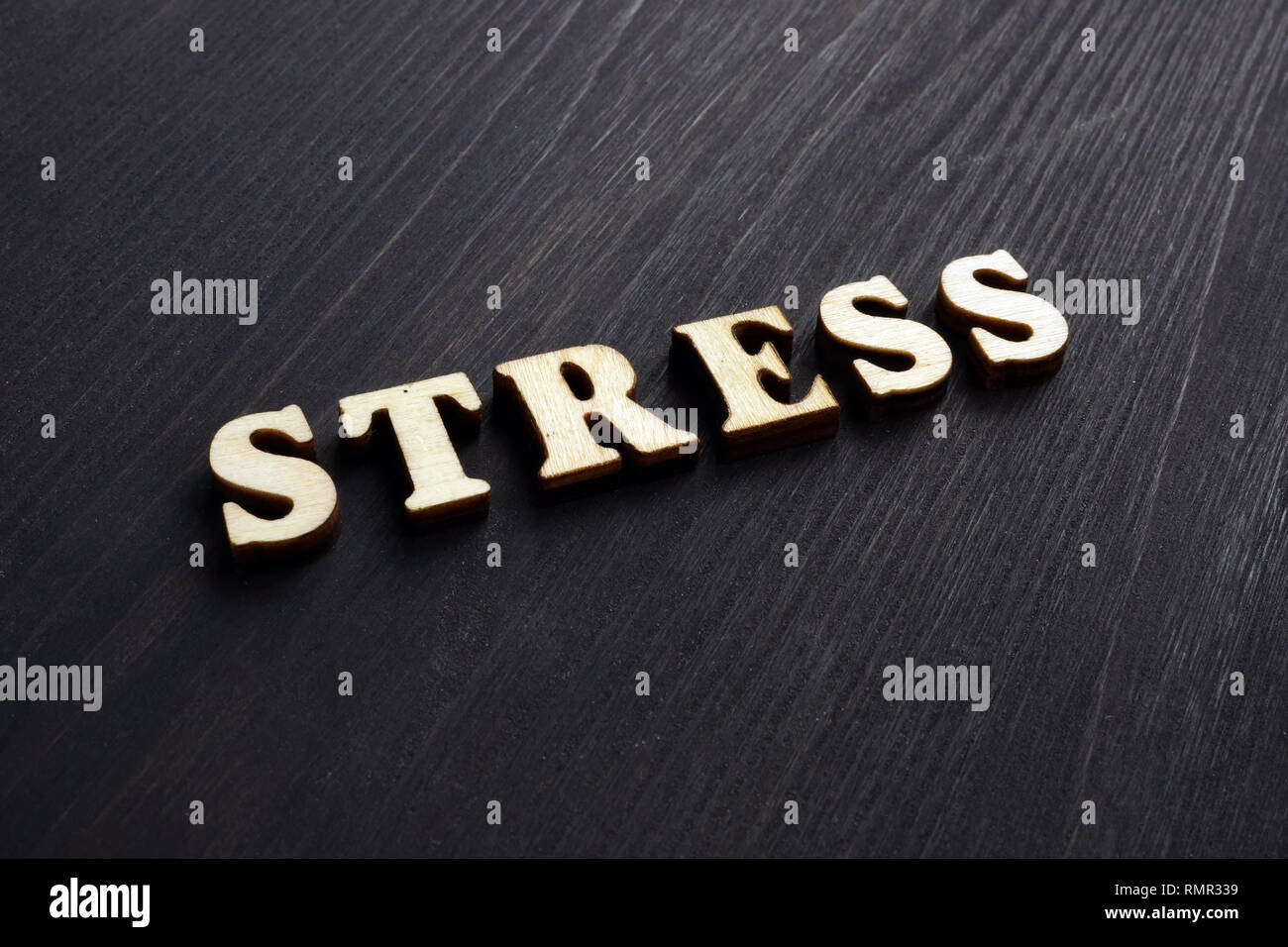 Word Stress from wooden letters on a desk Stock Photo - Alamy
