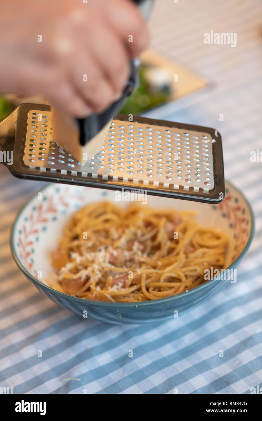 grinding parmesan cheese to carbonara Stock Photo - Alamy