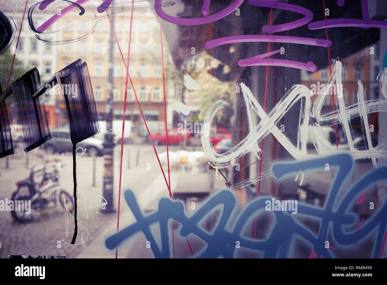 Street seen through window with graffiti Stock Photo - Alamy