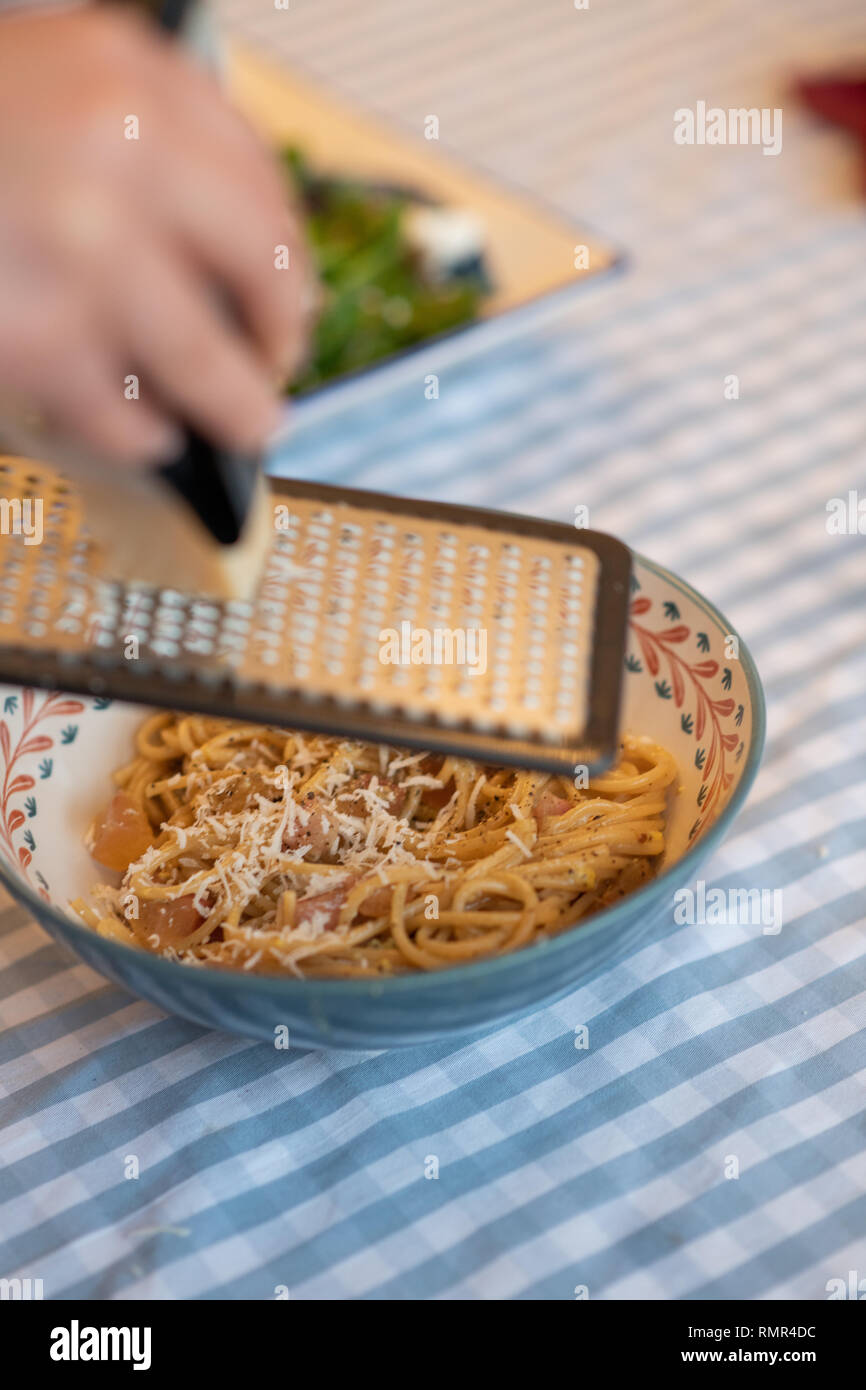 grinding parmesan cheese to carbonara Stock Photo - Alamy