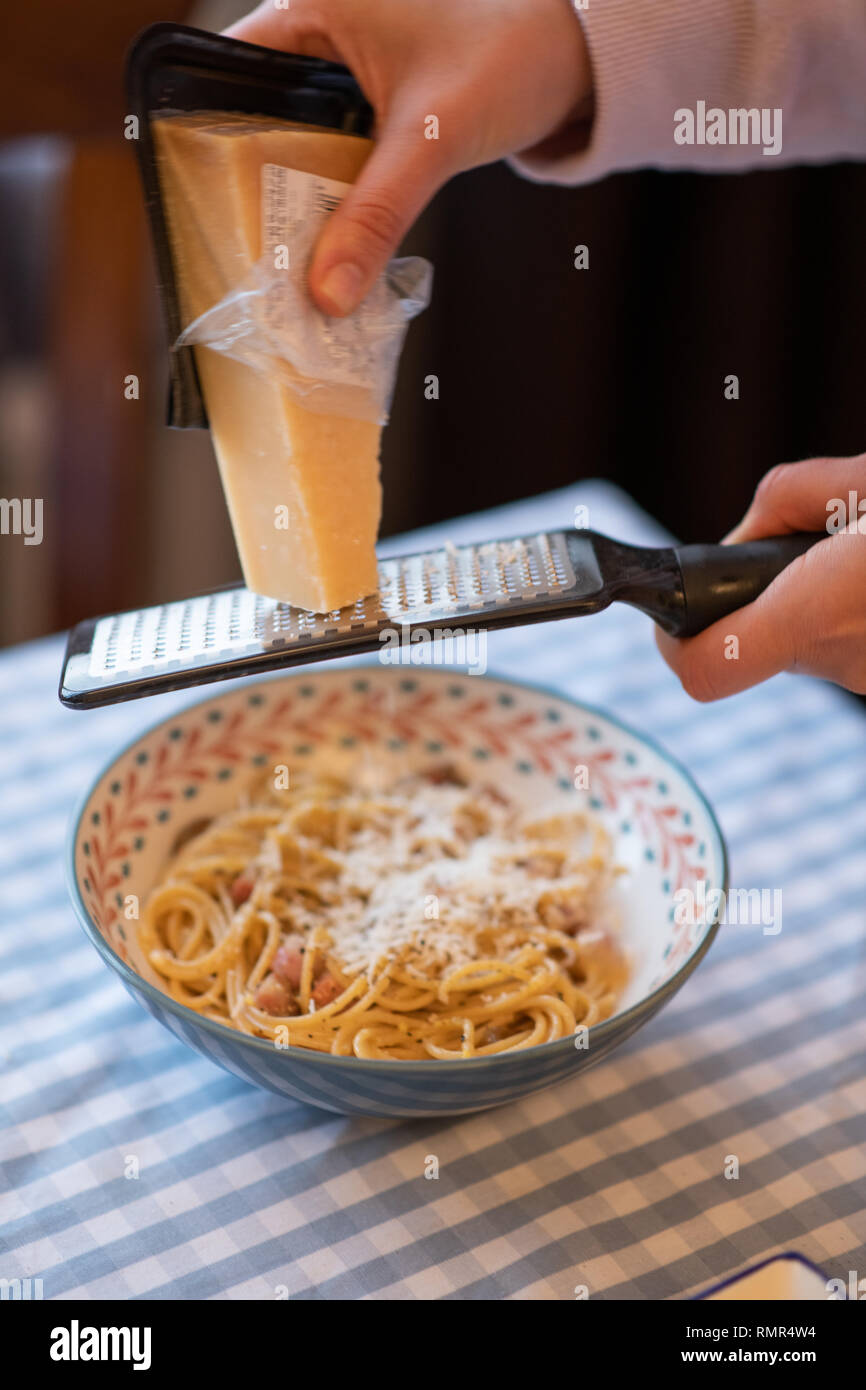 grinding parmesan cheese to carbonara Stock Photo - Alamy