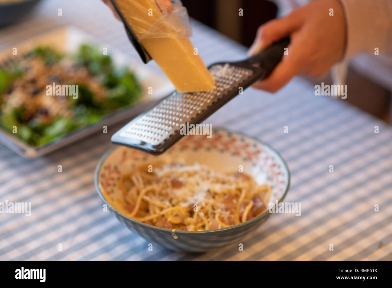 grinding parmesan cheese to carbonara Stock Photo - Alamy