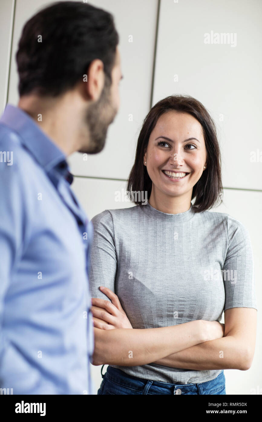 Smiling woman looking at camera Stock Photo - Alamy