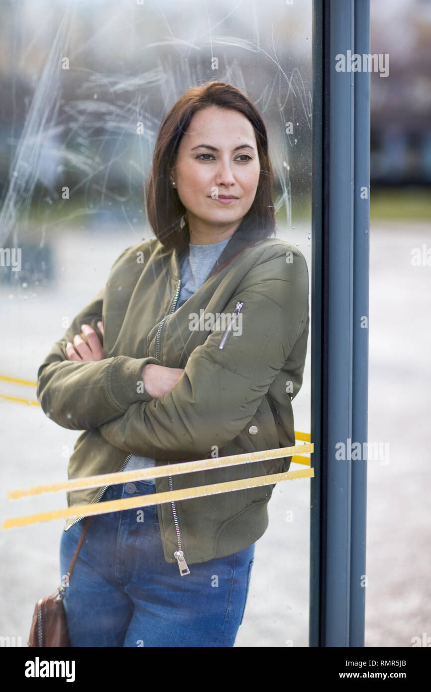 Woman waiting at bus stop hi-res stock photography and images - Alamy