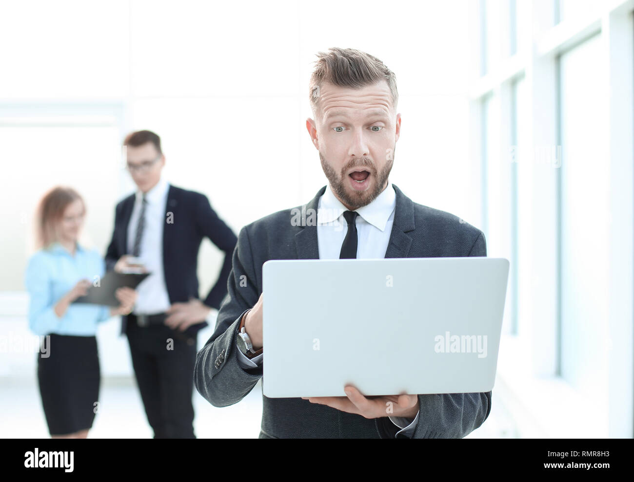 Surprised man looking computer screen hi-res stock photography and ...