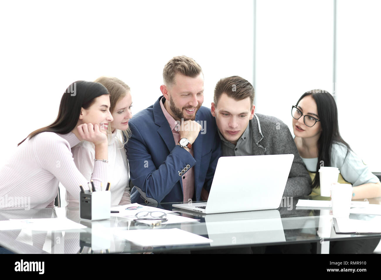 business team looking at laptop screen at work meeting in offic Stock ...
