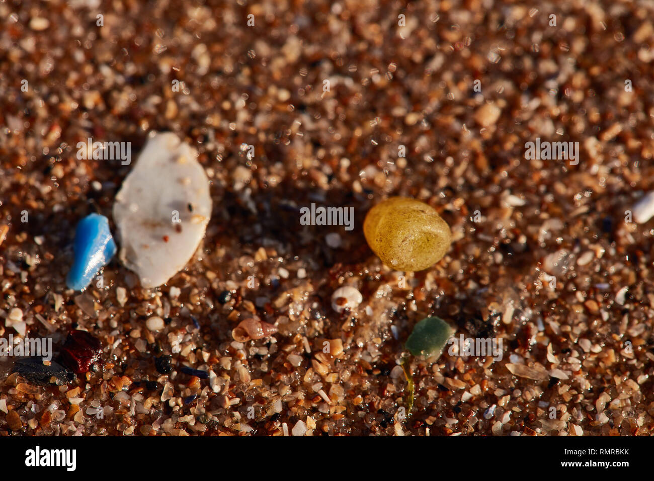 micro plastic nurdles on sand 4 Stock Photo - Alamy
