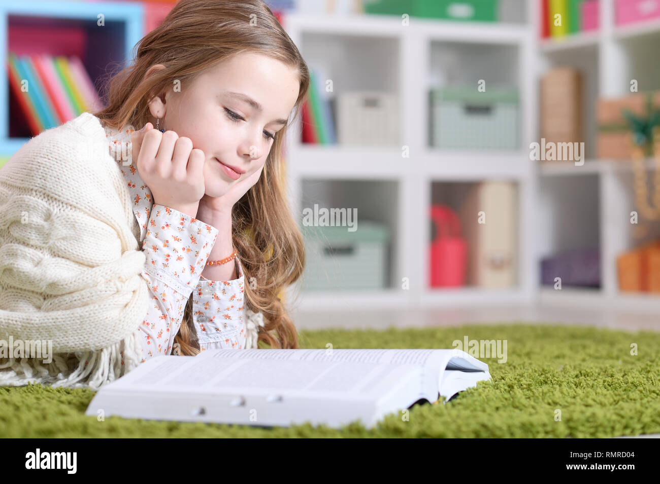 Portrait of cute happy girl studying at home Stock Photo - Alamy