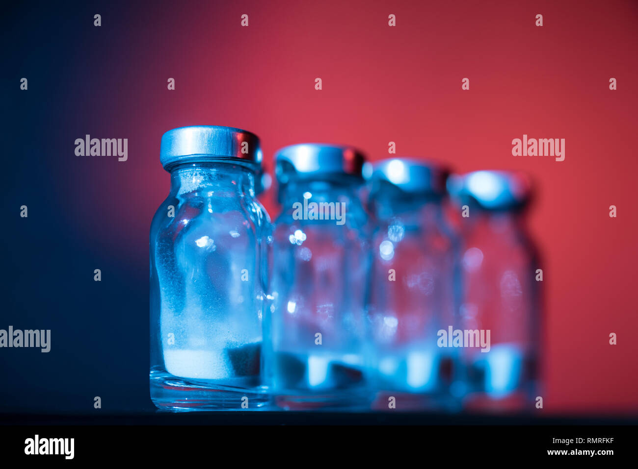 Bottles for injection with white powder on a color background Stock ...