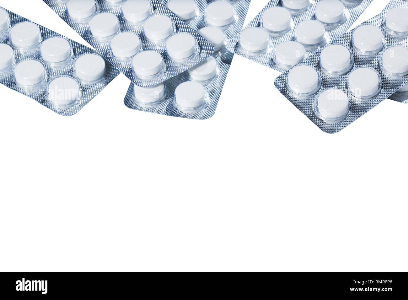 White pills in silver packaging on a white background Stock Photo - Alamy