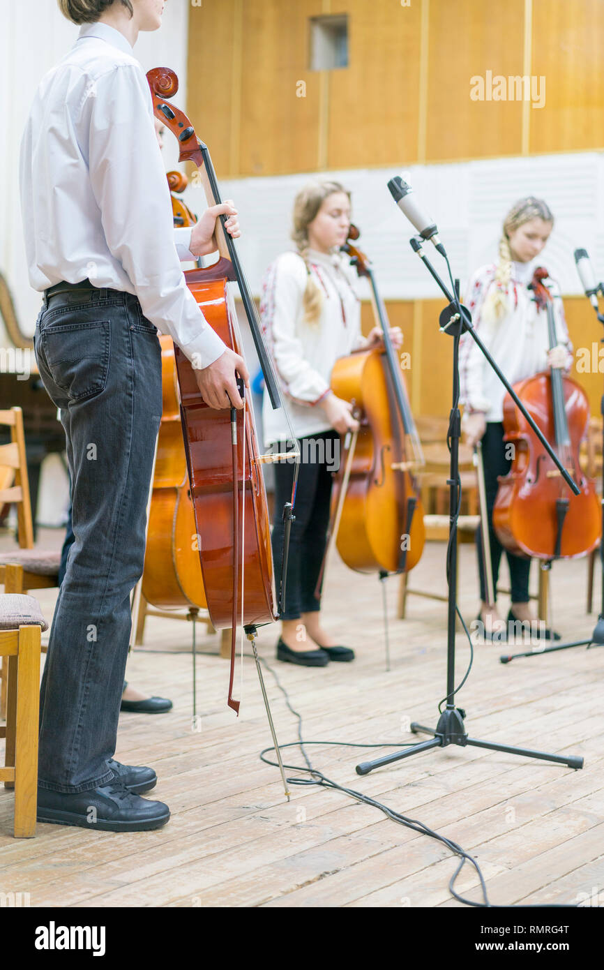 Children's violin ensemble. Children with violins on stage. Children's ...