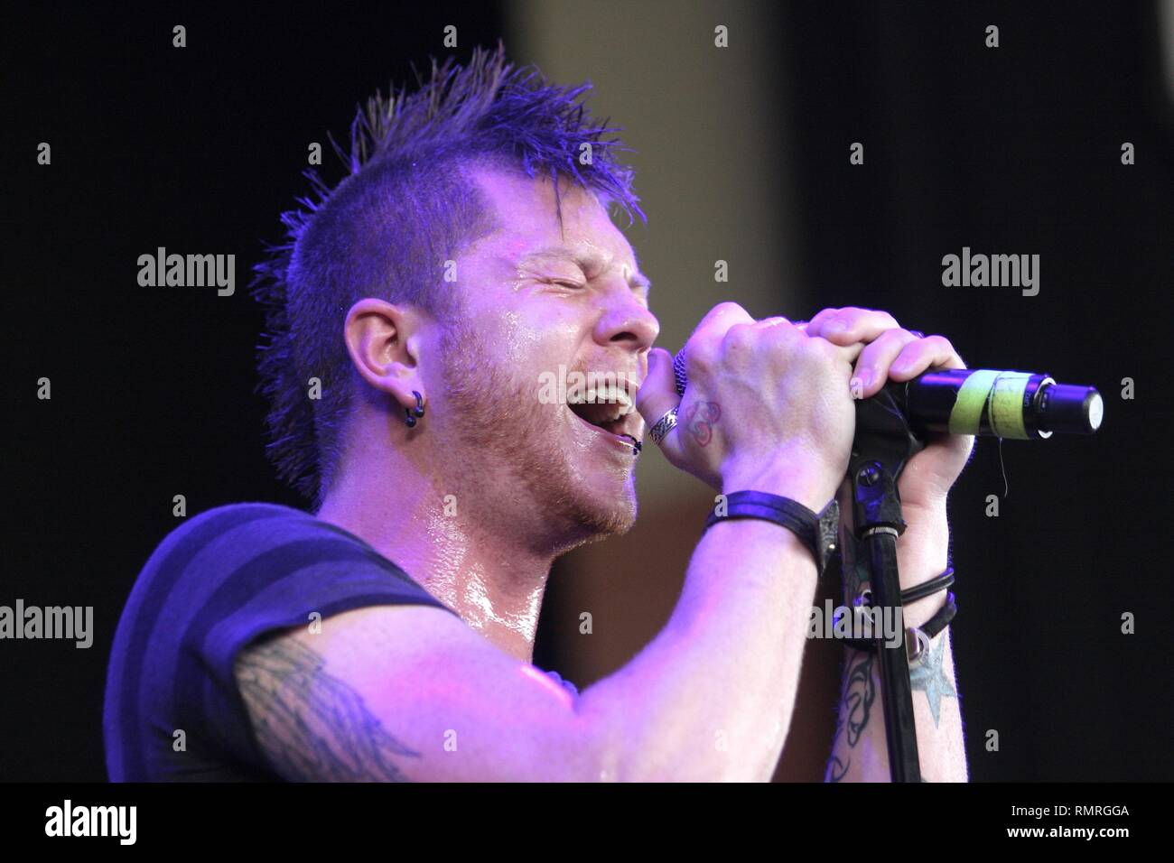 Singer Jared Weeks of Saving Abel is shown performing on stage during a ...