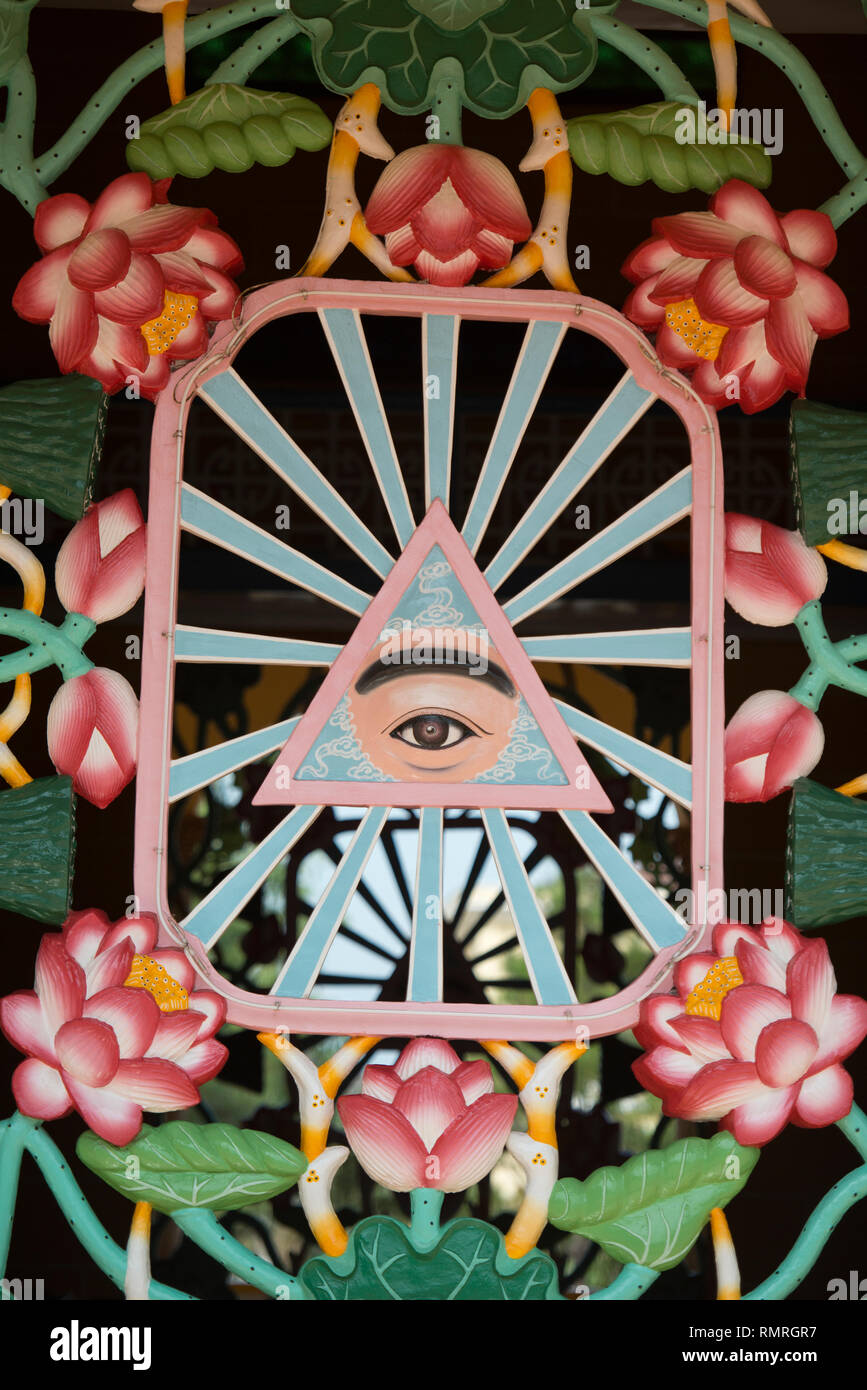 All-seeing eye, in temple window, Cao Dai Temple, Tay Ninh, near HCMC ...