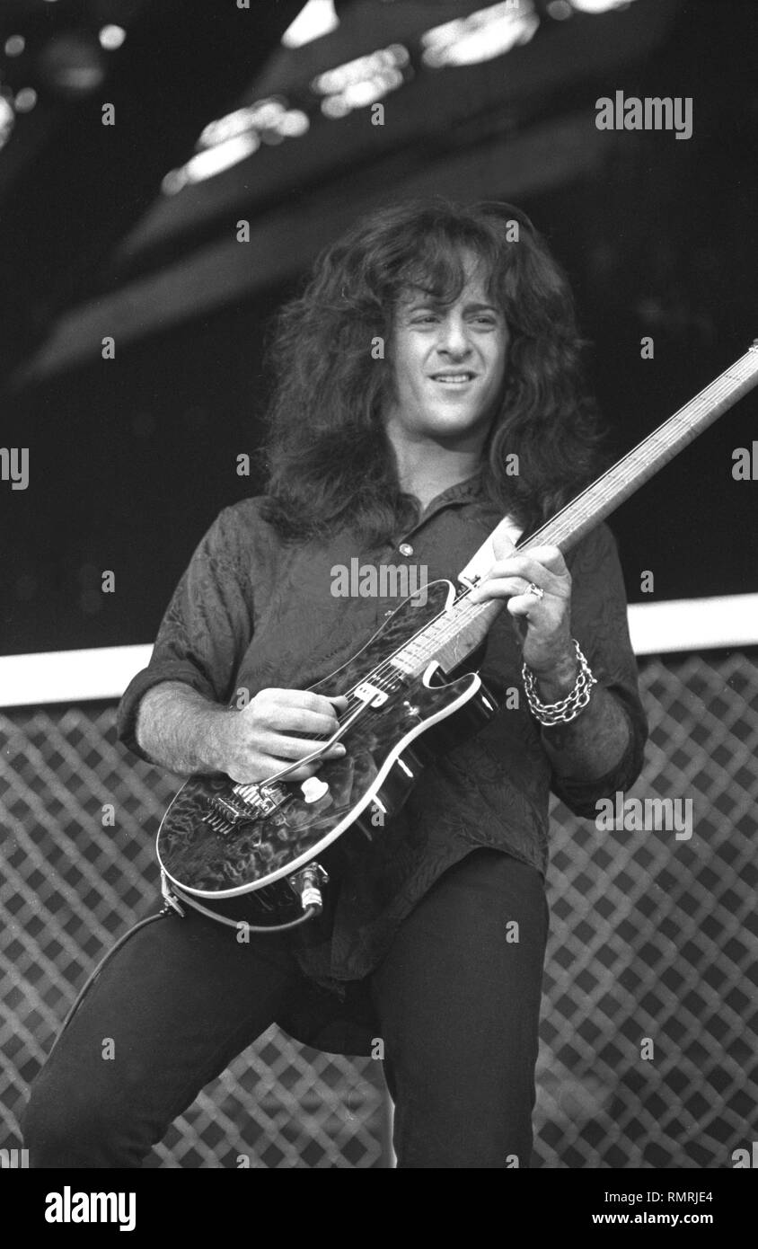 Lead guitarist Steve Steven is shown performing with the Vince Neil ...