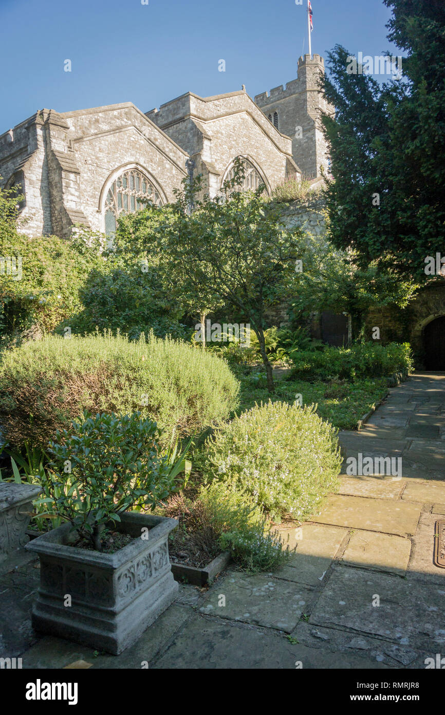 Tranquil herb garden with an English church in the background Stock ...