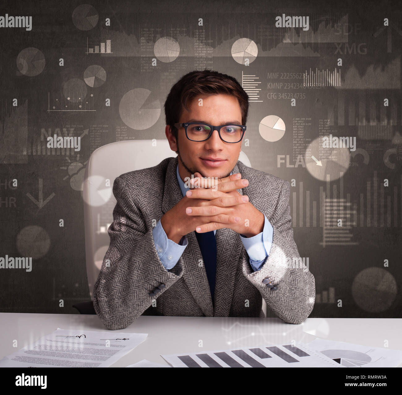 Young manager at the office making report and statistics with ...