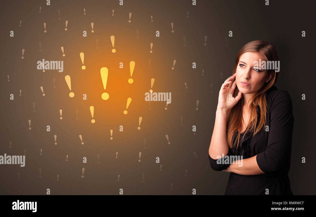 Young person standing with exclamation sign concept Stock Photo - Alamy