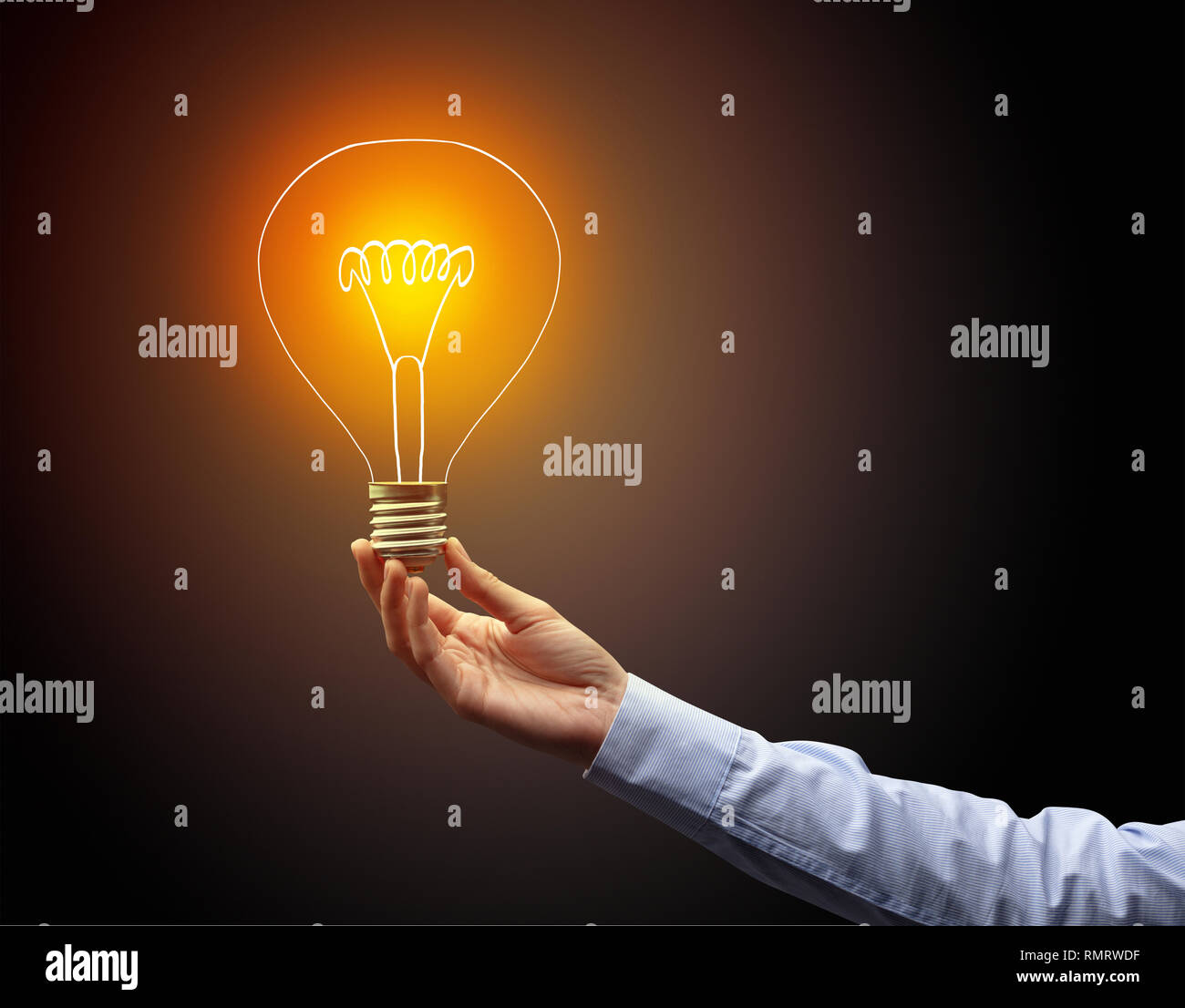 Hand holding light bulb on dark background, new idea concept Stock Photo - Alamy