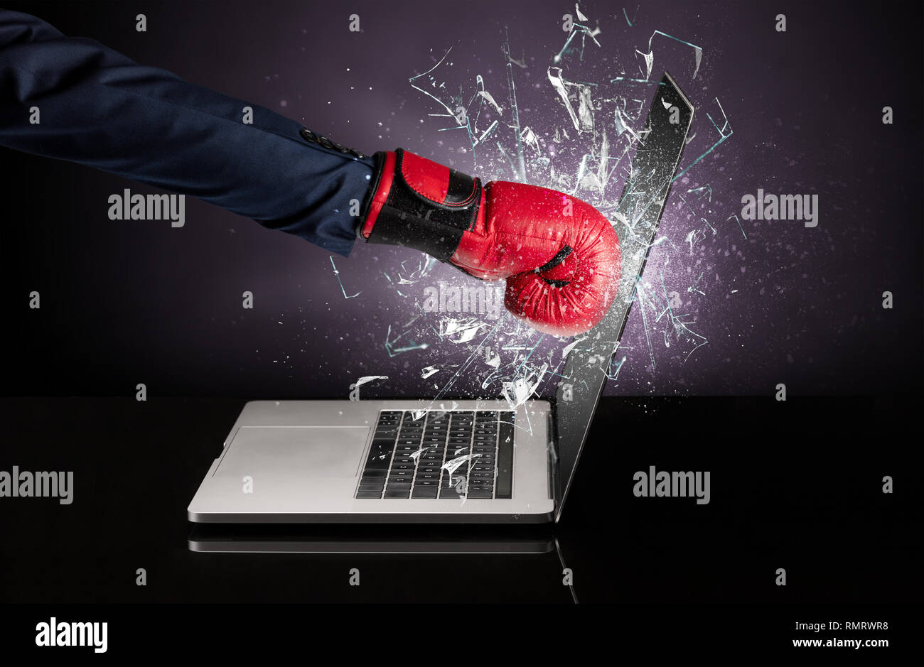 Hand hitting strongly laptop screen glass Stock Photo - Alamy