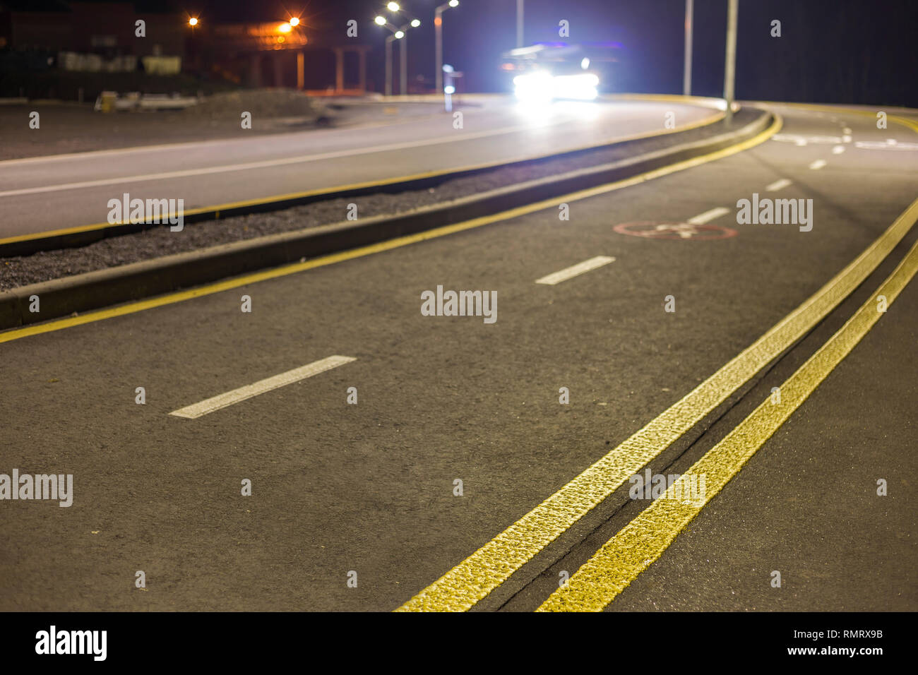 Wide modern smooth empty asphalt highway sharp turn sharp with bright ...