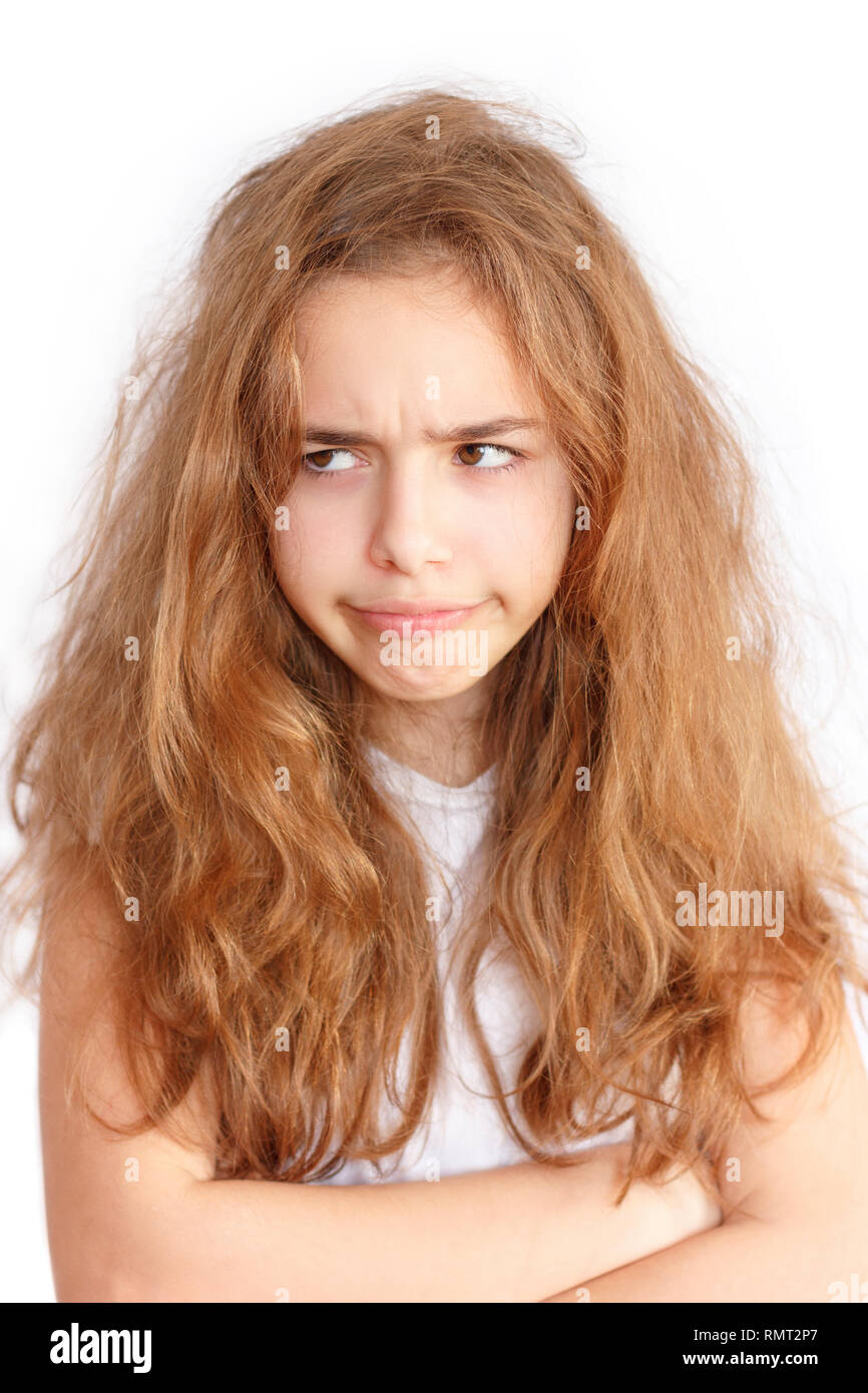Pretty teenager girl with a long hair makes very angry funny face Stock ...
