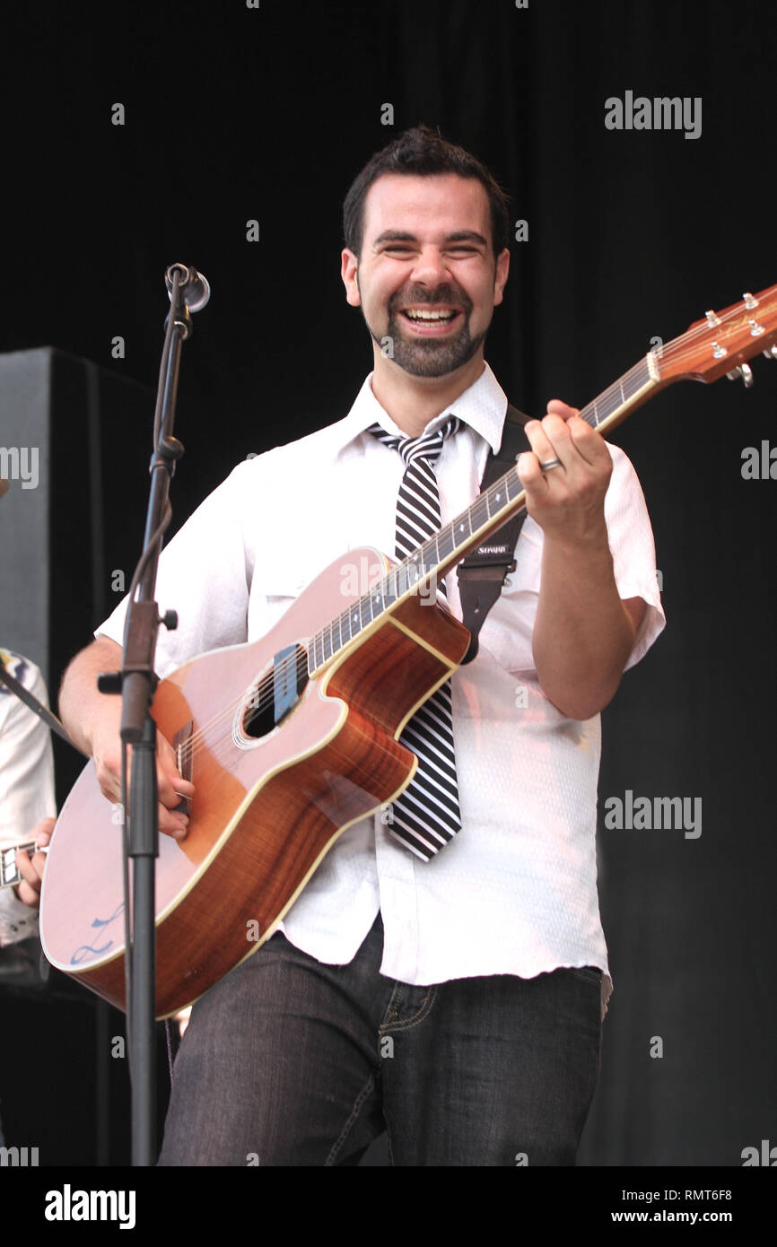Guitarist and singer Dan Lebowitz of AOL is shown performing on stage ...