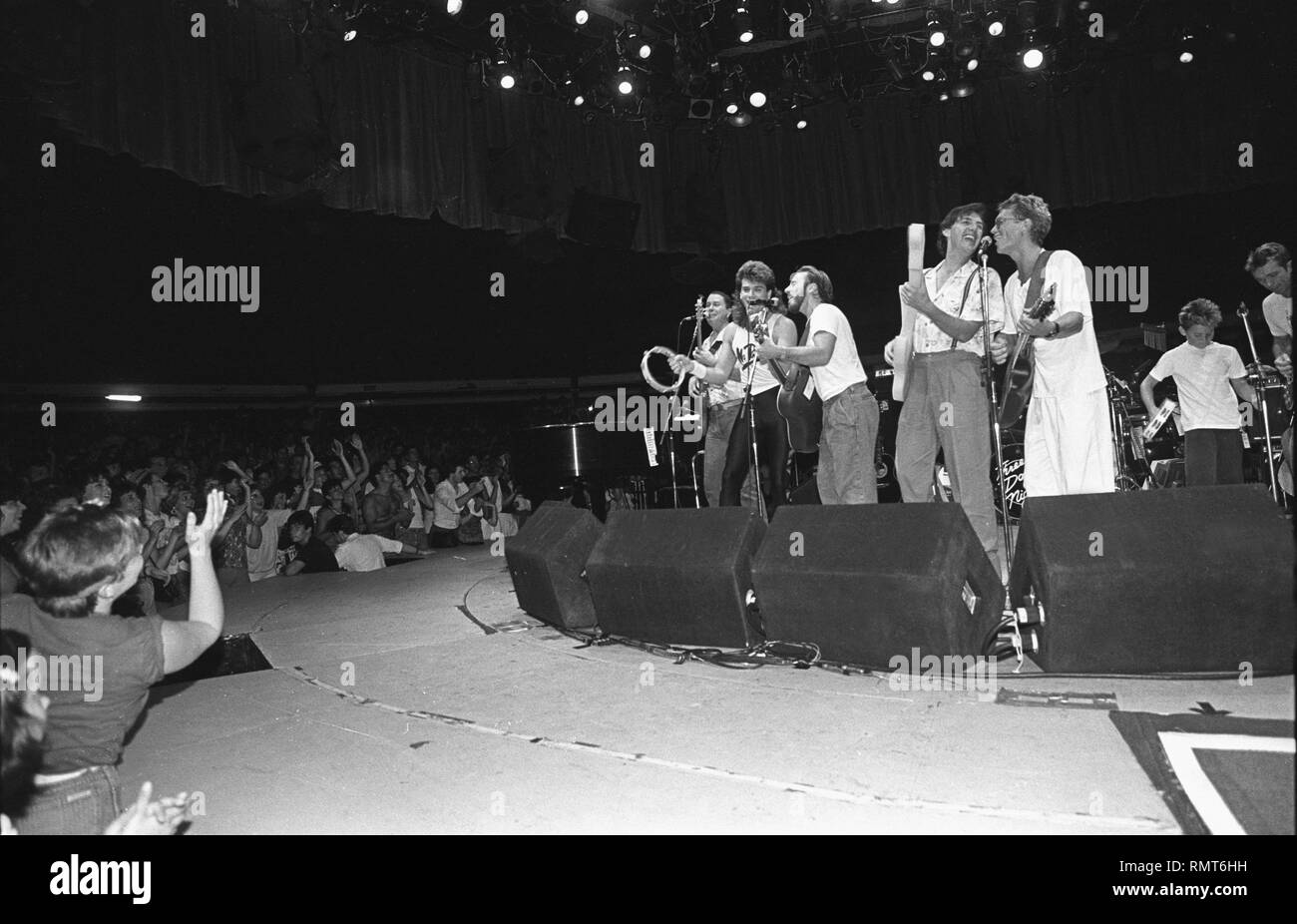 Musicians of the band America are shown performing on stage during a ...