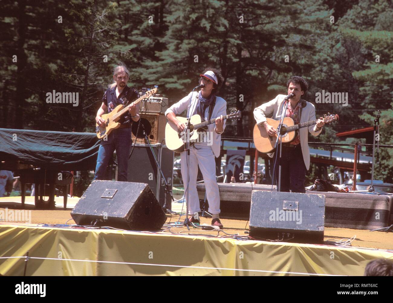 Aztec Two Step band members are shown performing outdoors at the ...