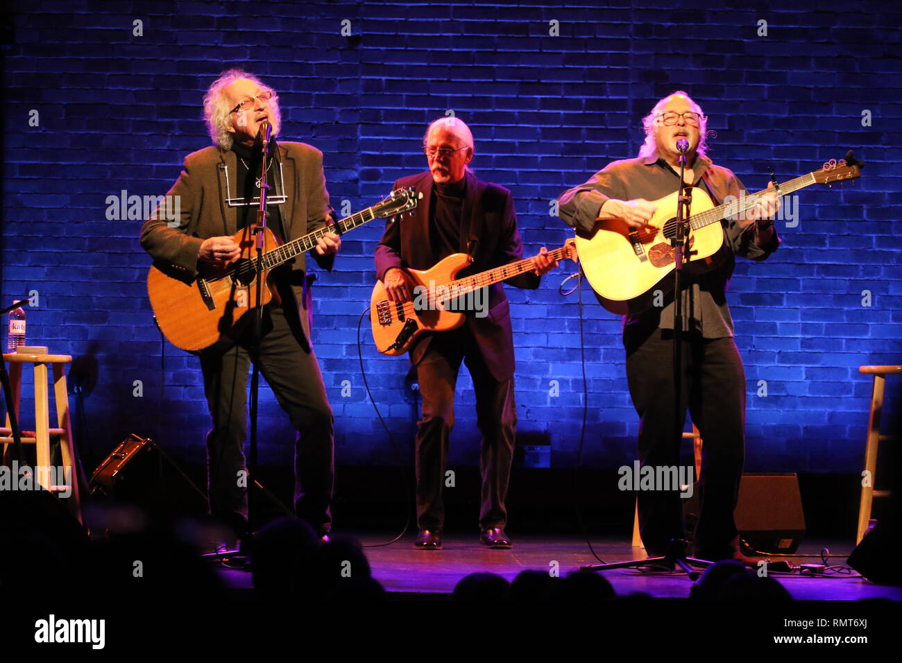 Aztec Two Step is shown performing on stage during a "live" concert ...