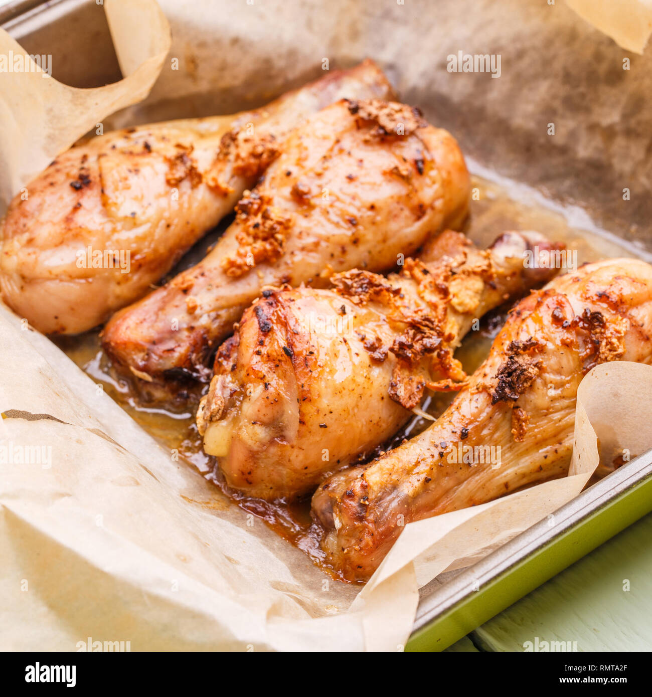 Prepared chicken on cooking paper Stock Photo - Alamy