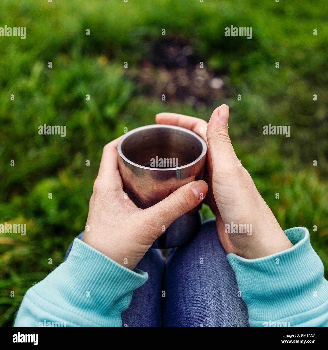 Woman traveler hands holding cup of tea. Adventure, travel, tourism and ...