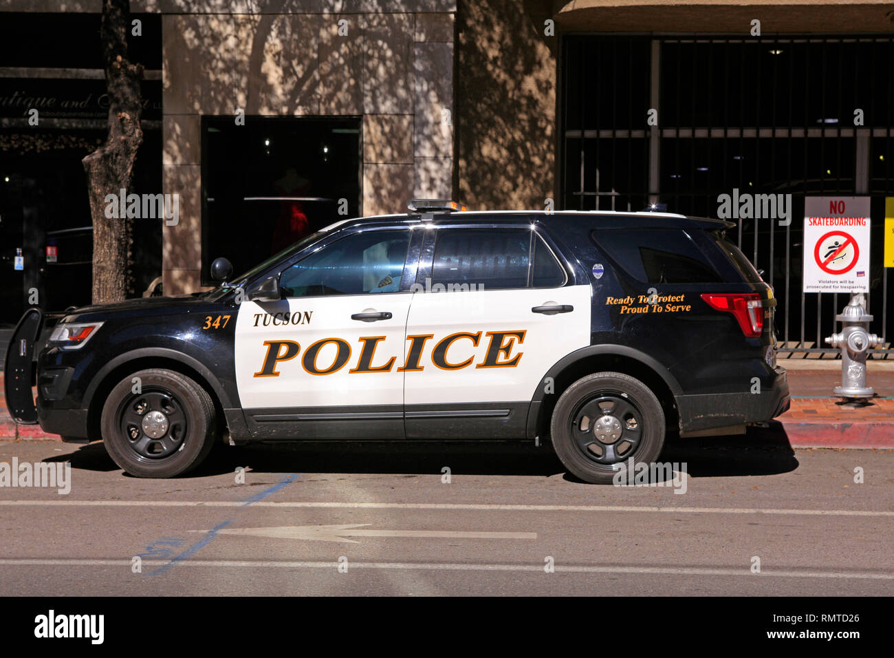 Black and white Tucson Police cruiser parked in a red zone in downtown ...