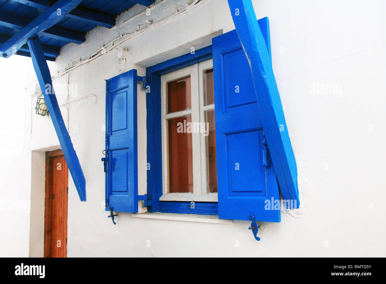 Building exterior with shutters Stock Photo - Alamy