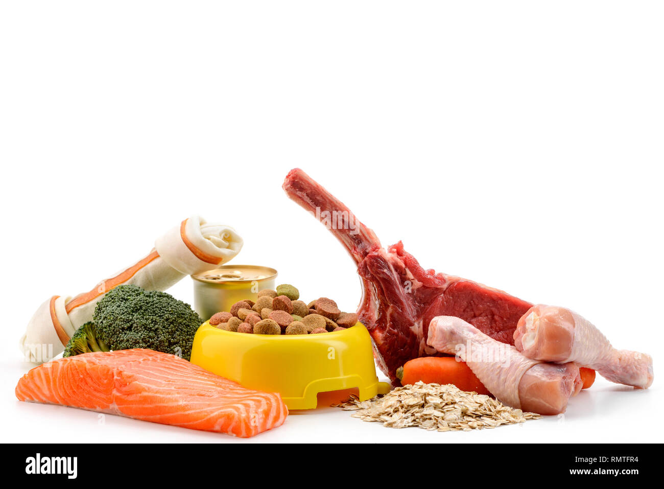 Dog kibbles, bone and ingredients Stock Photo - Alamy