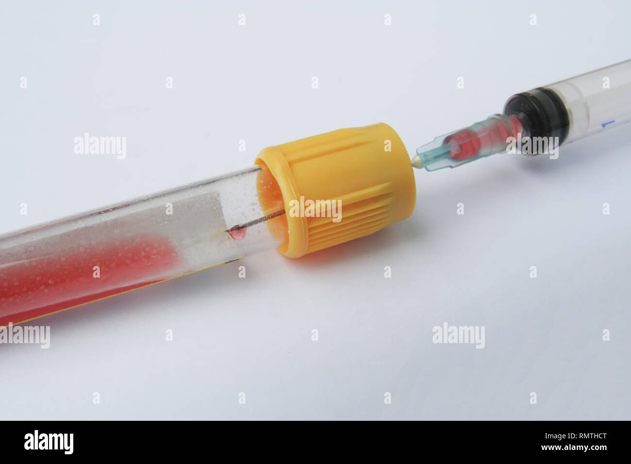 Laboratory blood sample. Laboratory test tube and syringe with blood ...