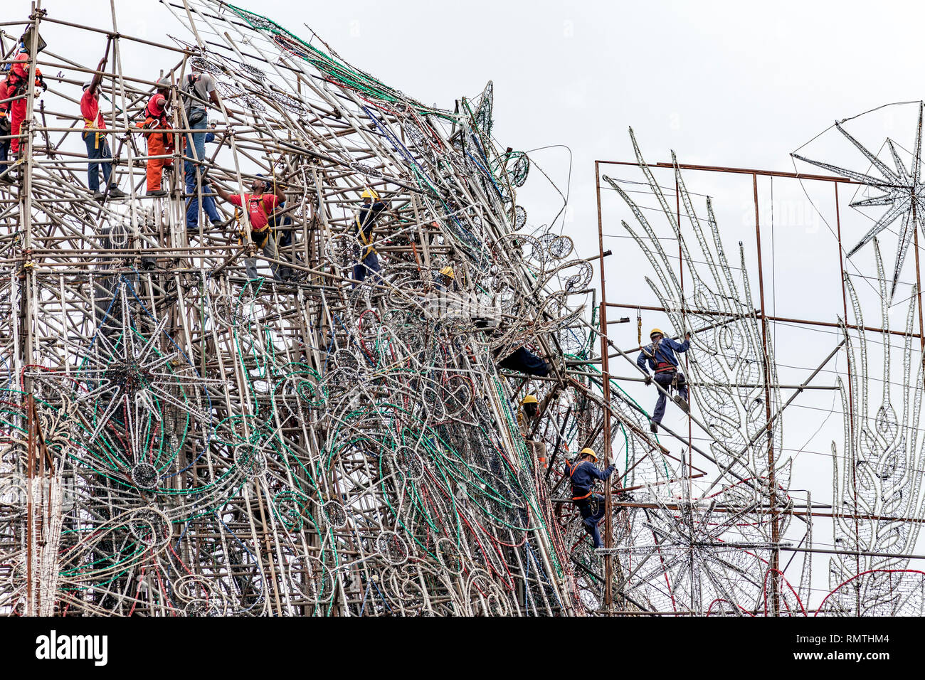 Workers reviewing the damage of the collapsed floating Christmas tree ...