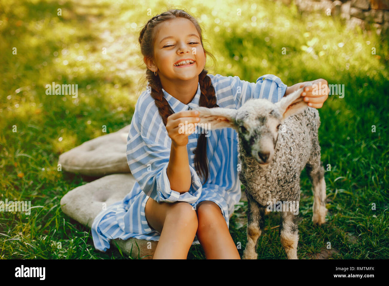 beautiful girl with goat Stock Photo - Alamy
