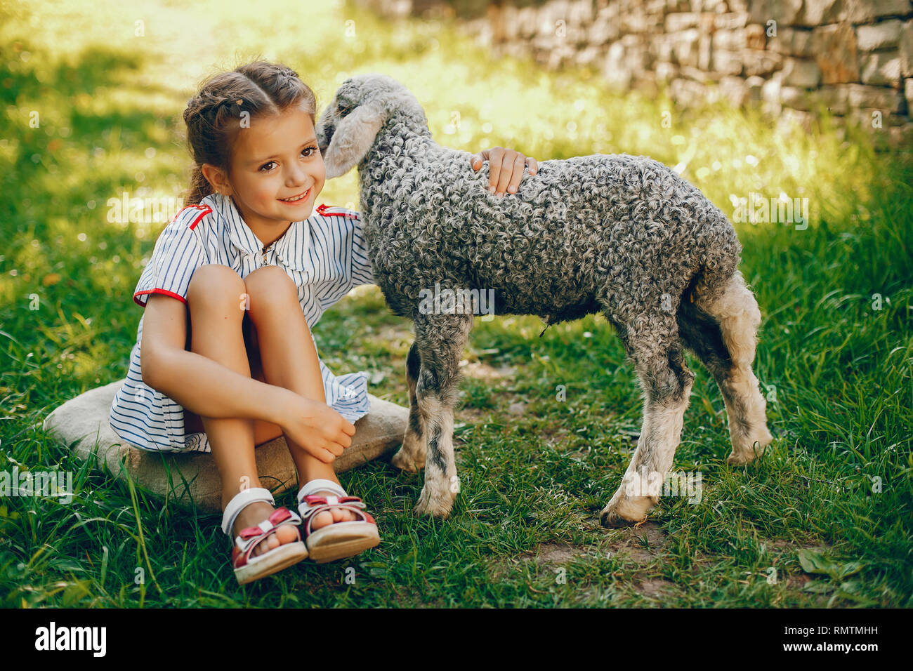 beautiful girl with goat Stock Photo - Alamy