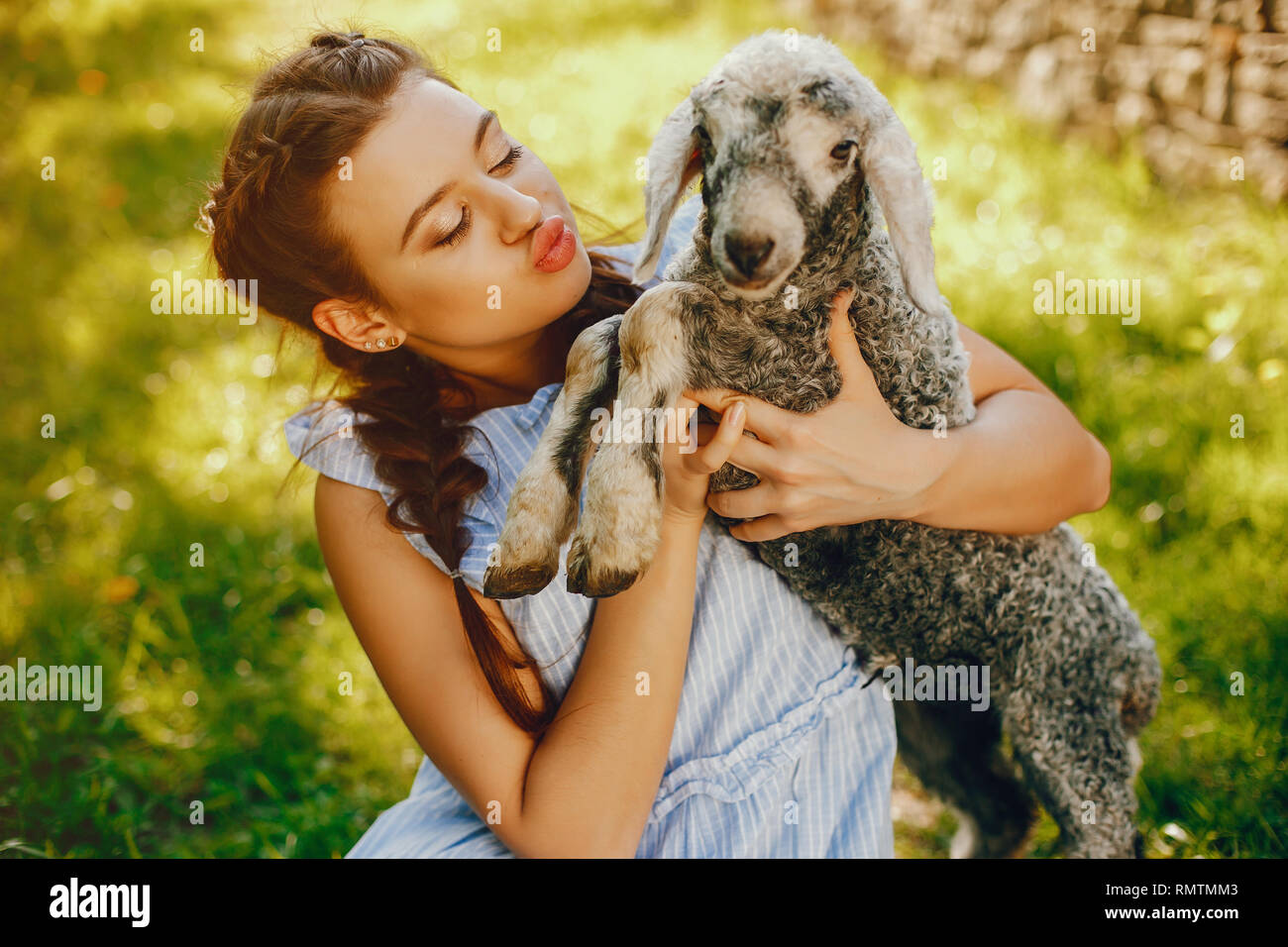 beautiful girl with goat Stock Photo - Alamy