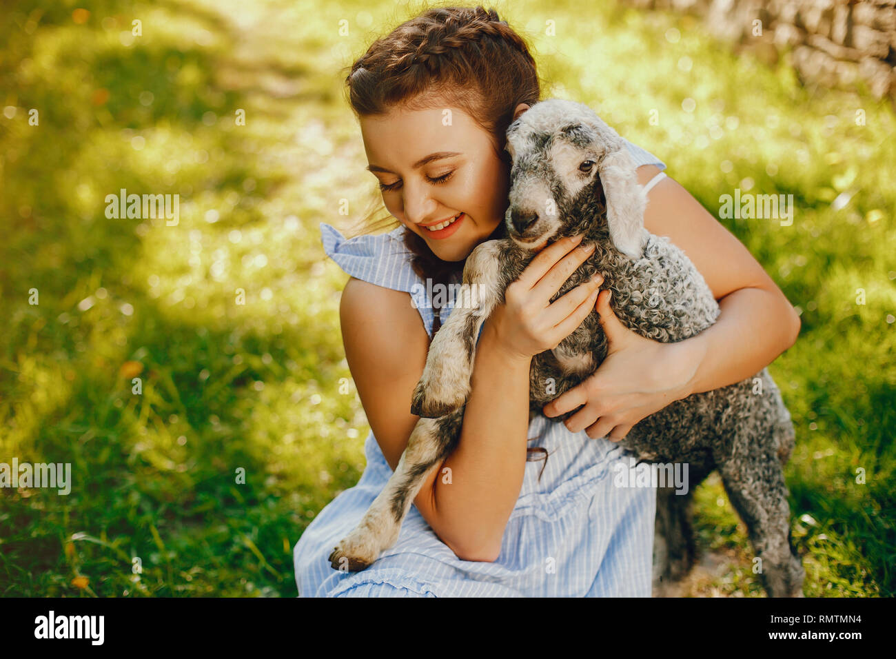 beautiful girl with goat Stock Photo - Alamy