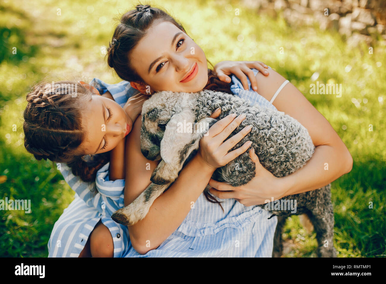 beautiful girl with goat Stock Photo - Alamy