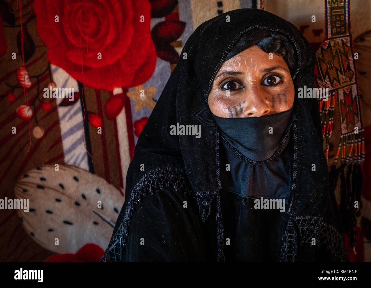 Portrait of a Rashaida tribe veiled woman inside her tent, Kassala ...