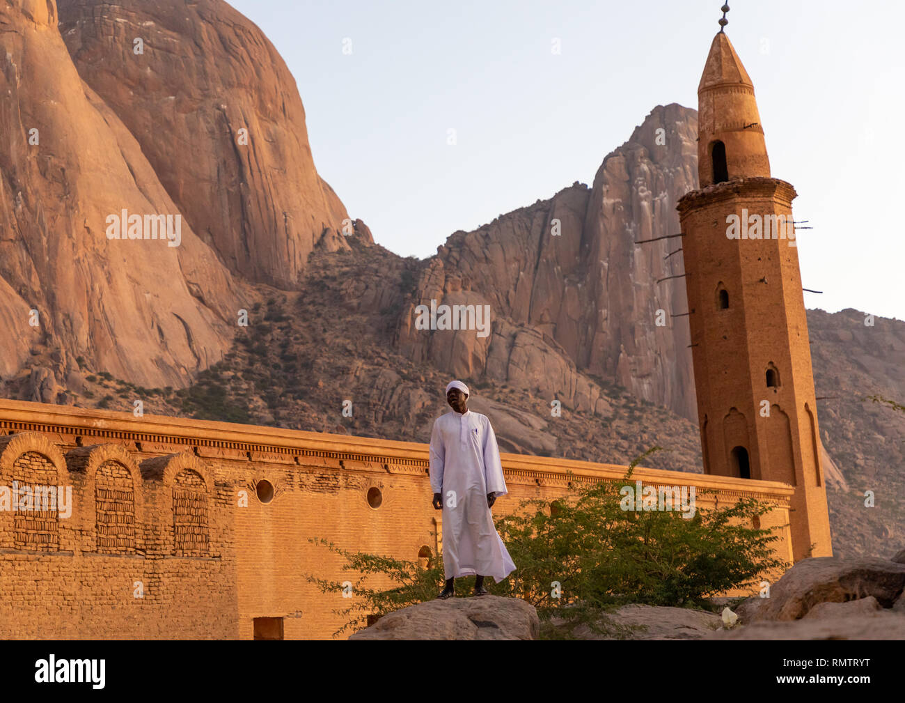 Muezzin making the call to prayers in front of Khatmiyah mosque at the ...