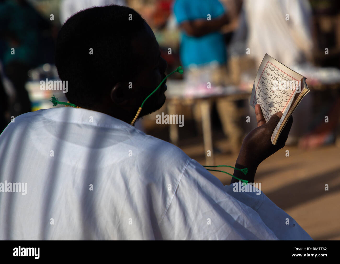 Sudanese man reading the quran during the friday sufi celebration at ...