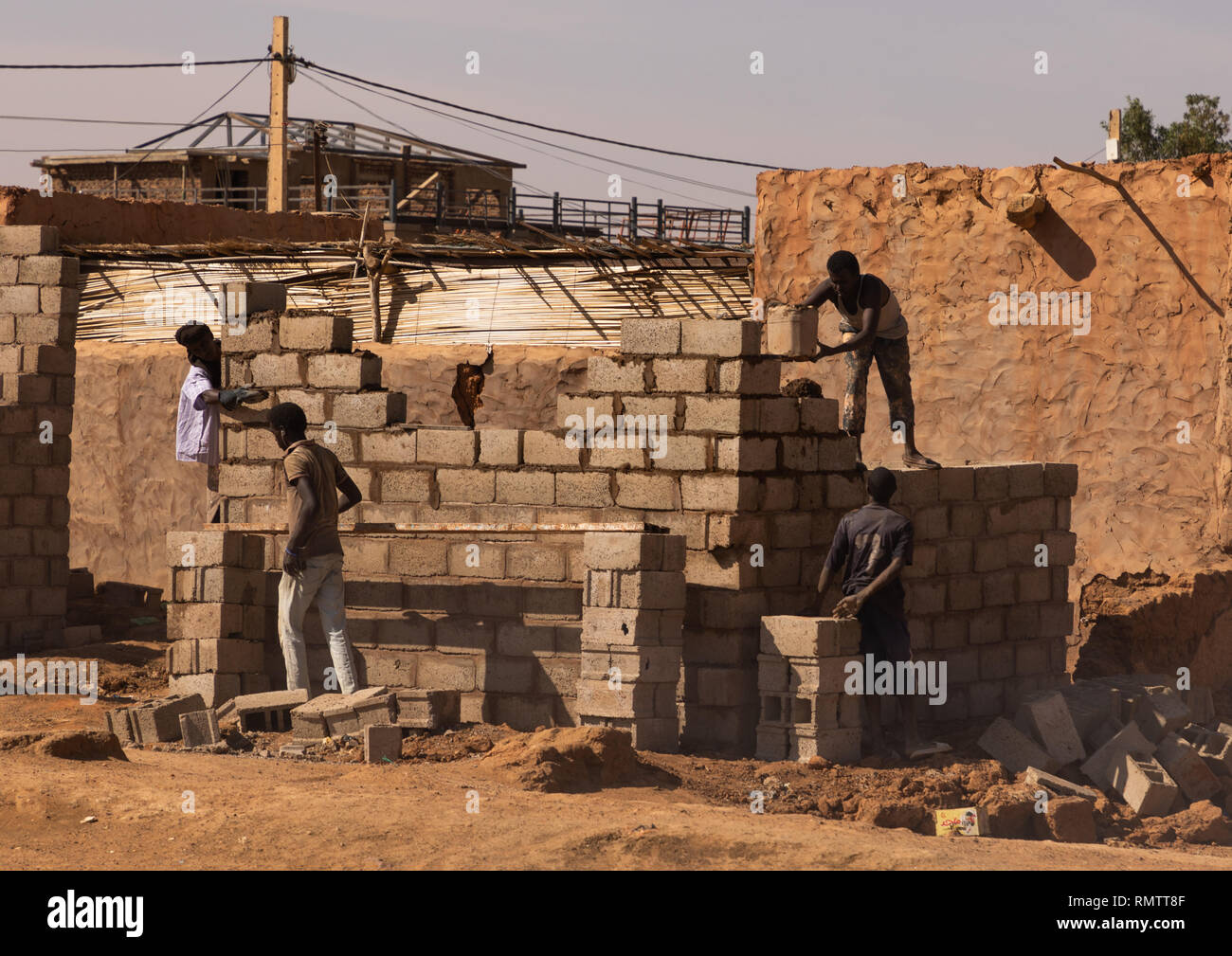 Sudanese men building a house in a village, Khartoum State, Omdurman ...