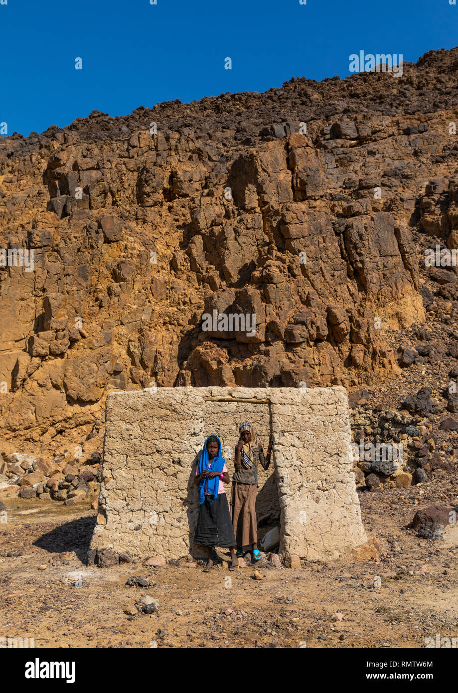 Bisharin nomad girls collecting salt in Atrun crater, Bayuda desert ...