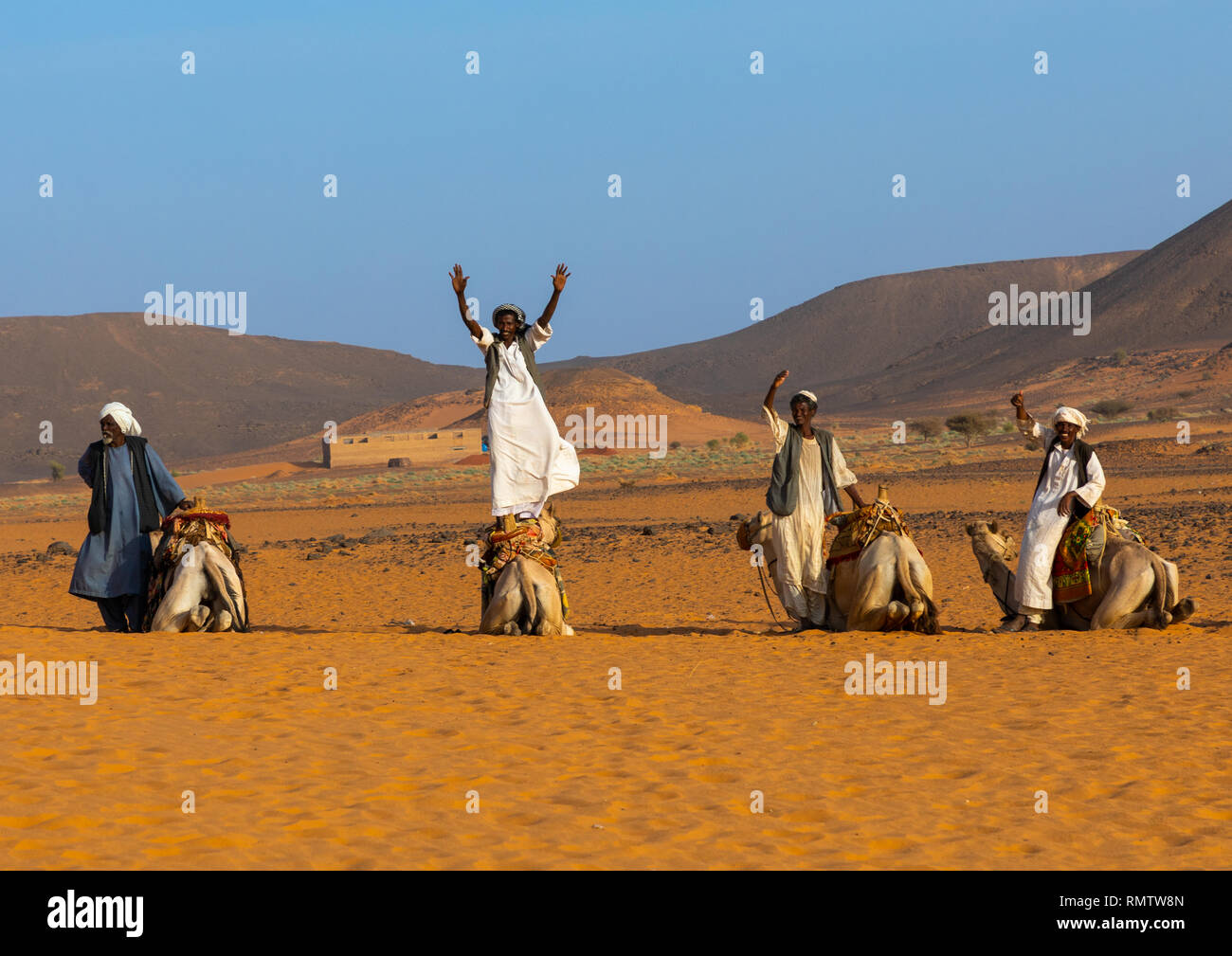 Sudanese men and their camels in Meroe, Northern State, Meroe, Sudan ...