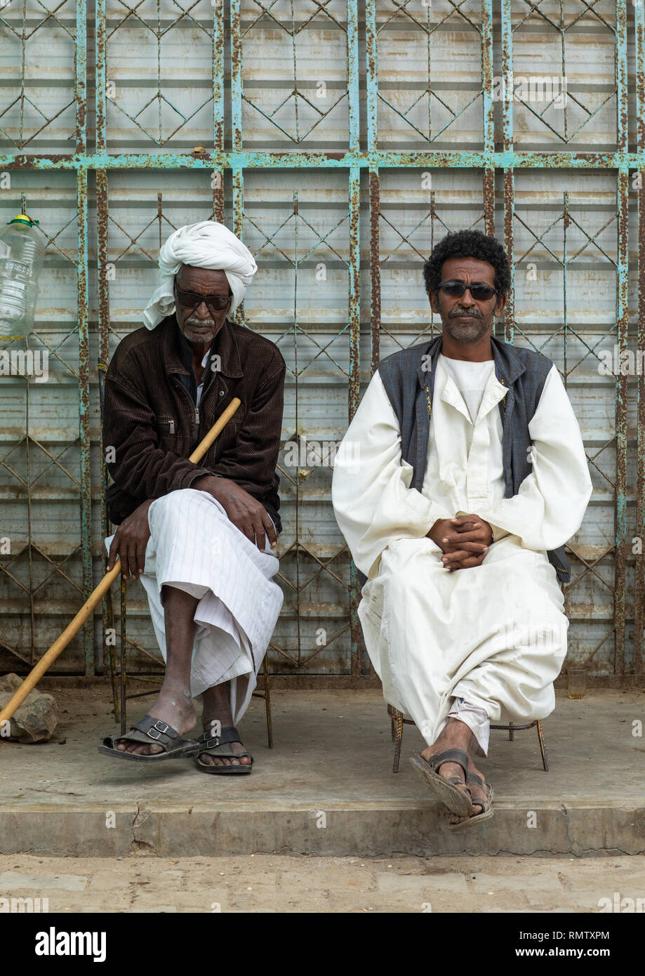 Portrait of Beja tribe men sit in the street, Red Sea State, Port Sudan ...